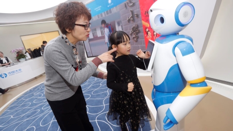 Robots ready to serve at insurance company's new store - SHINE News